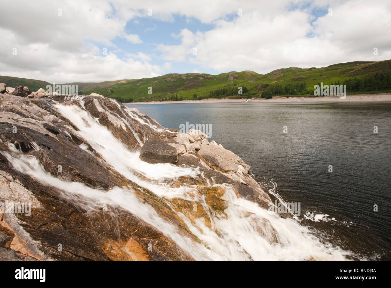 Water tumbling over rock that is normally 20 feet under water at ...