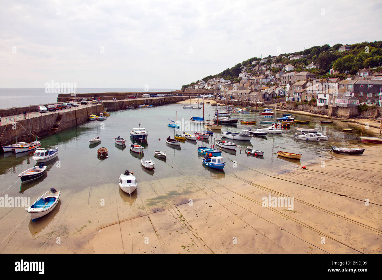Pretty fishing harbour village, Mousehole, Cornwall, England where ...