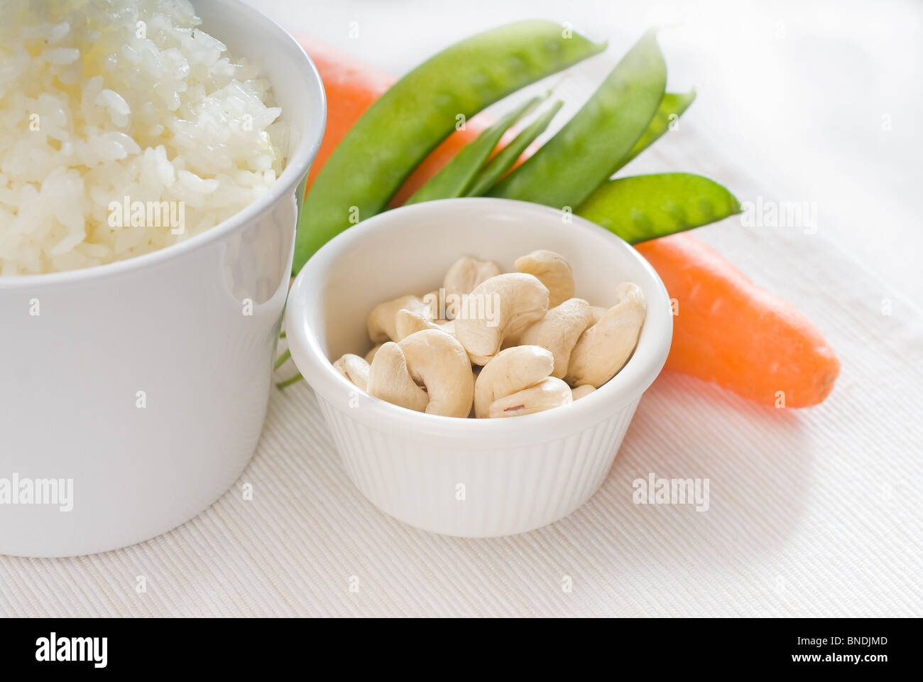 fresh cashew nut and vegetables,with steamed white rice ,typical ...