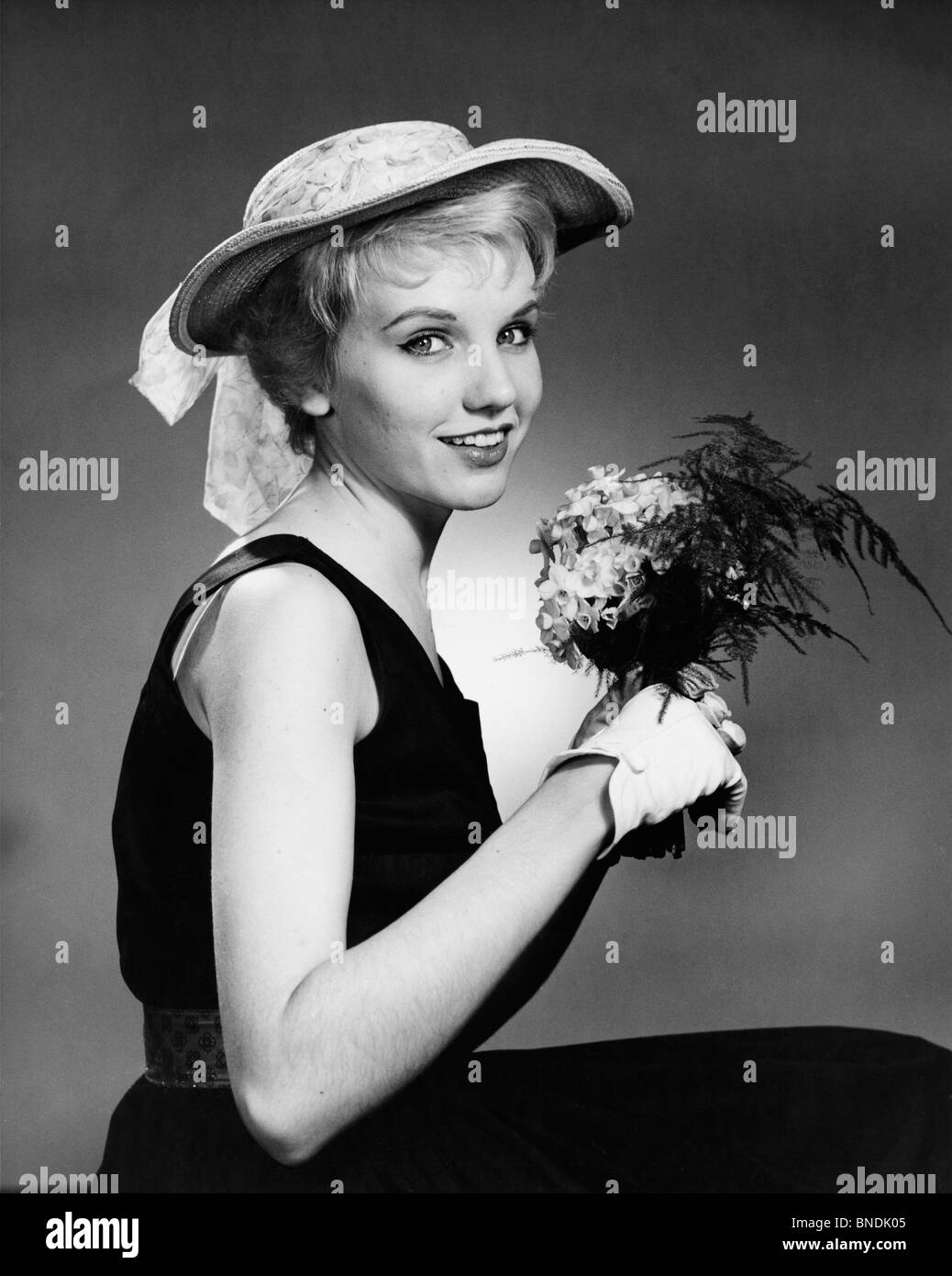 Young fashion woman sitting Black and White Stock Photos & Images - Alamy