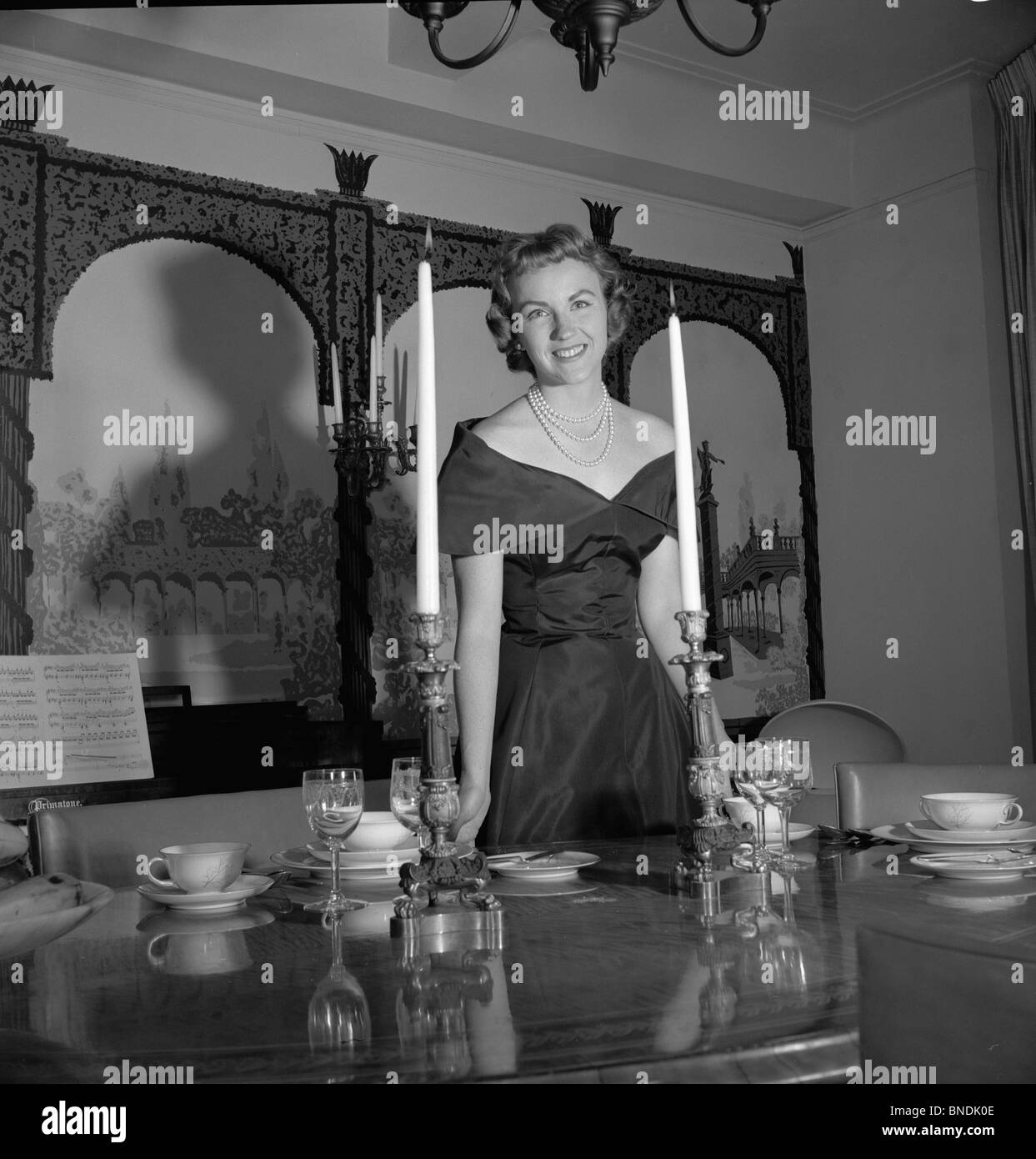 Table standing Black and White Stock Photos & Images - Alamy