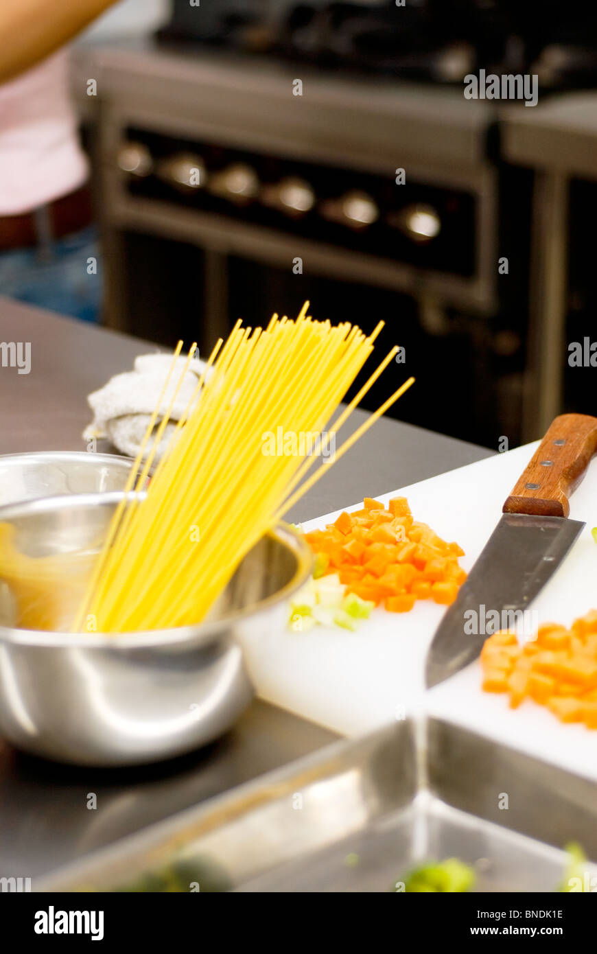 italian spaghetti pasta on a typical full equipped restaurant kitchen ...
