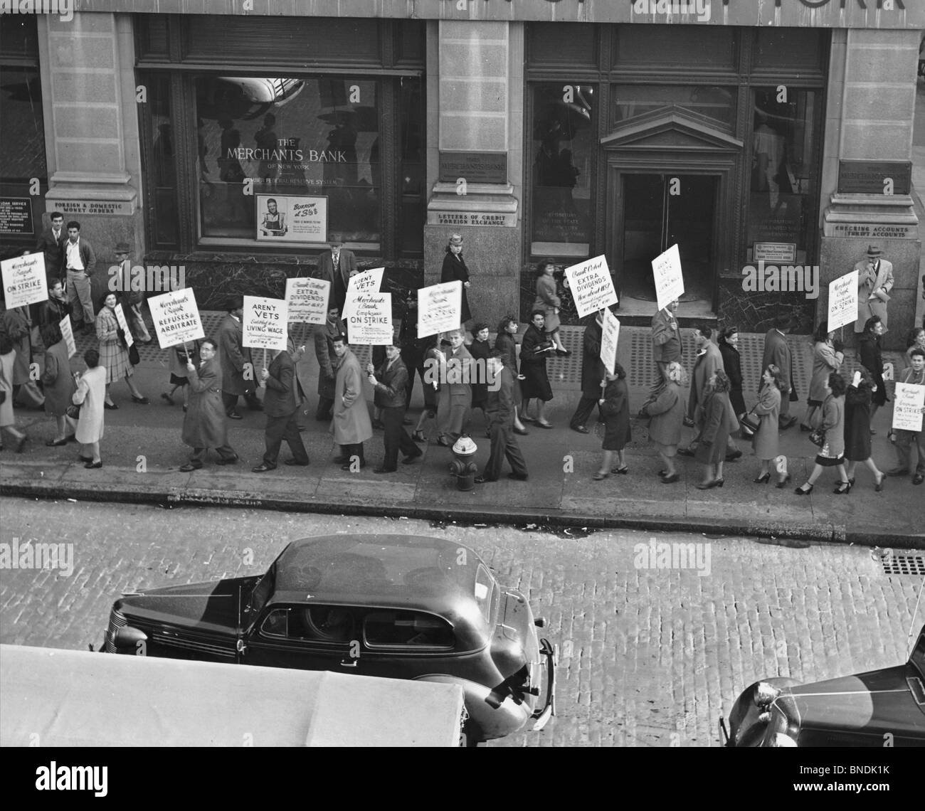 Group walking people holding signs hi-res stock photography and images ...