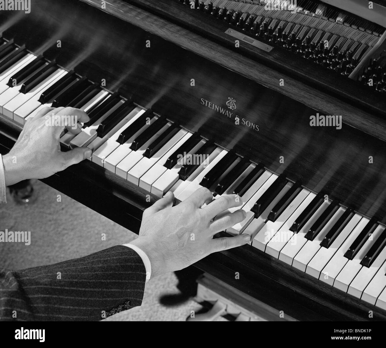 Playing a piano hi-res stock photography and images - Alamy