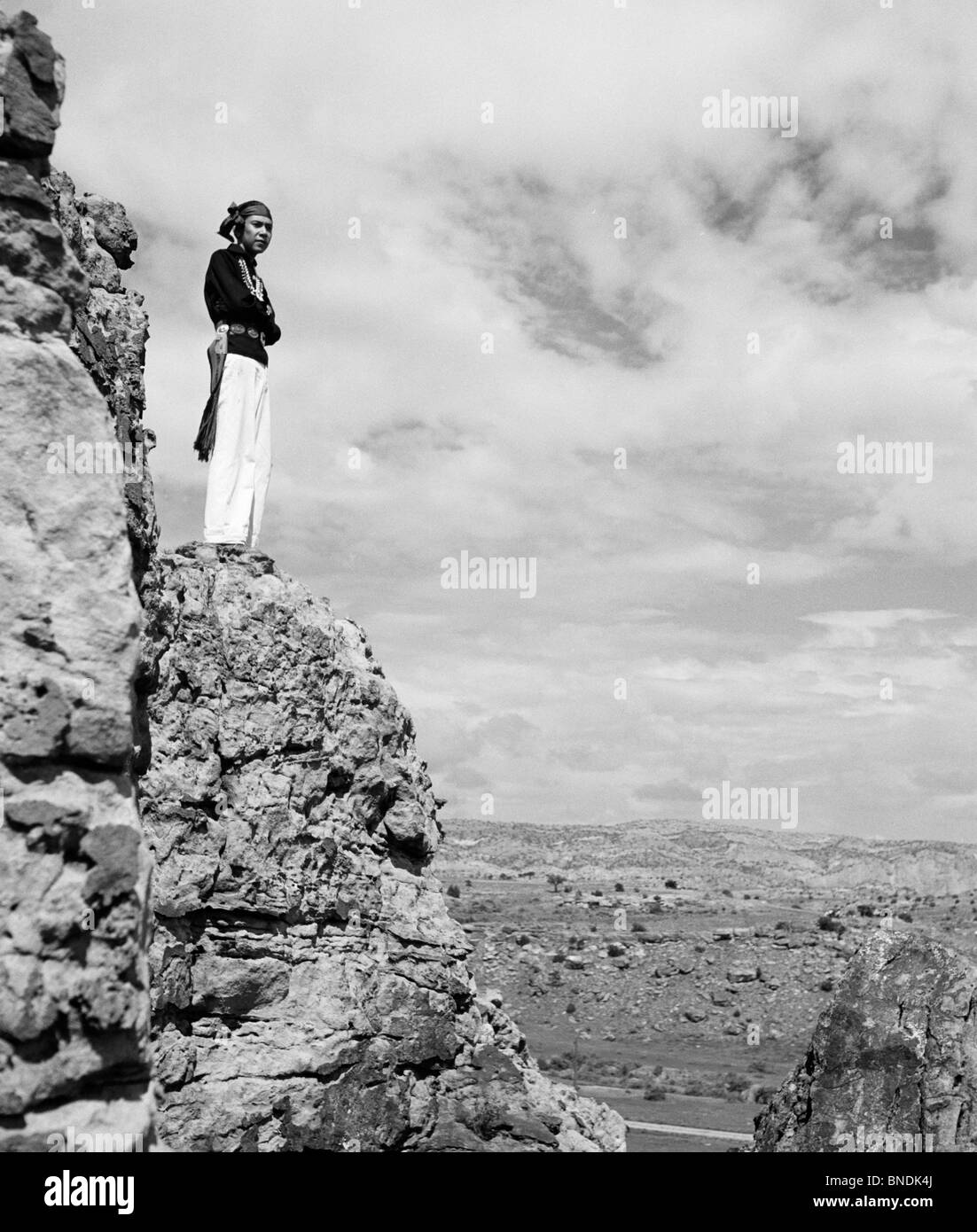 Hopi man standing on a rock Stock Photo - Alamy