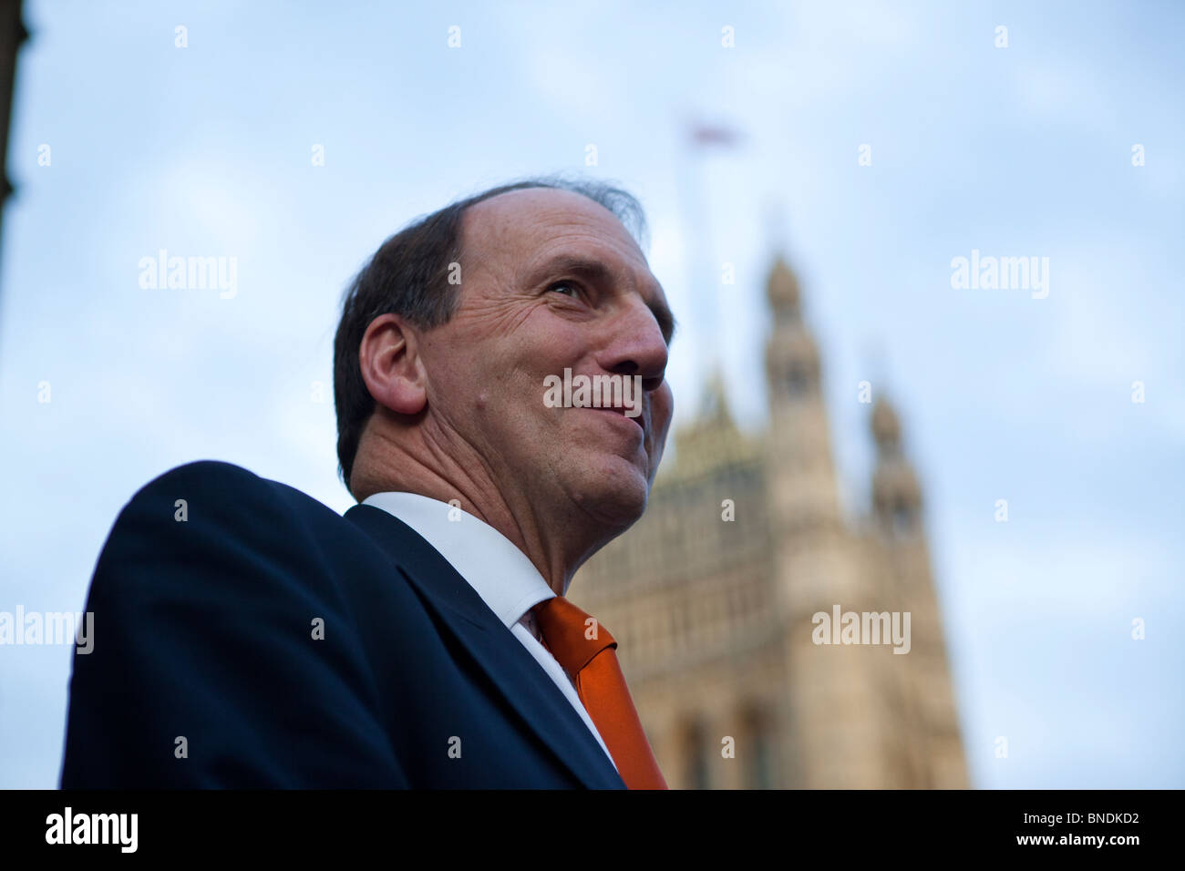 Lib Dem MP Simon Hughes, smiles for cameras outside Westminster after ...