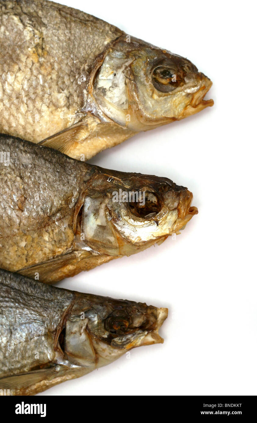 Dried salty fishes isolated on white background Stock Photo - Alamy