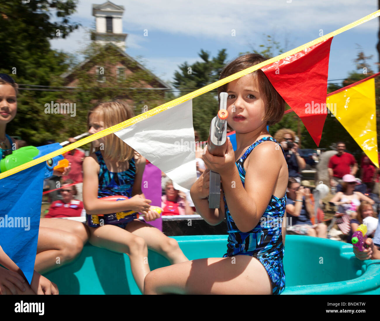 Amherst, New Hampshire - A girl riding in a float in the July 4 parade ...