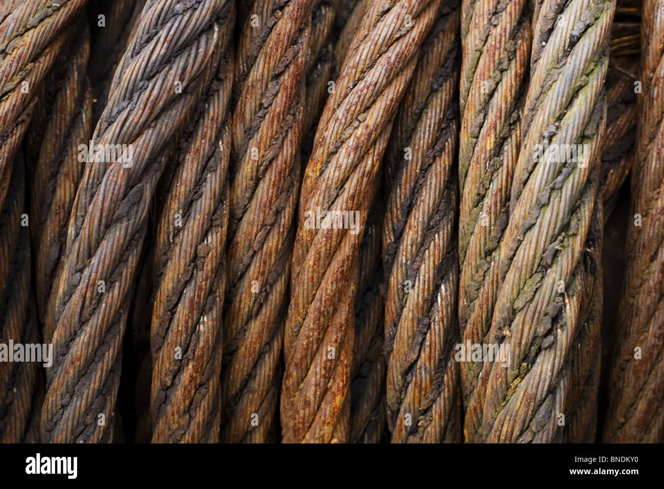 Rusty iron rope coil closeup Stock Photo - Alamy