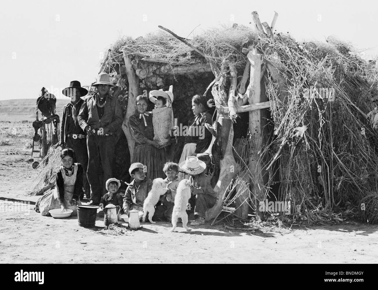 Family in front of hut Stock Photo - Alamy