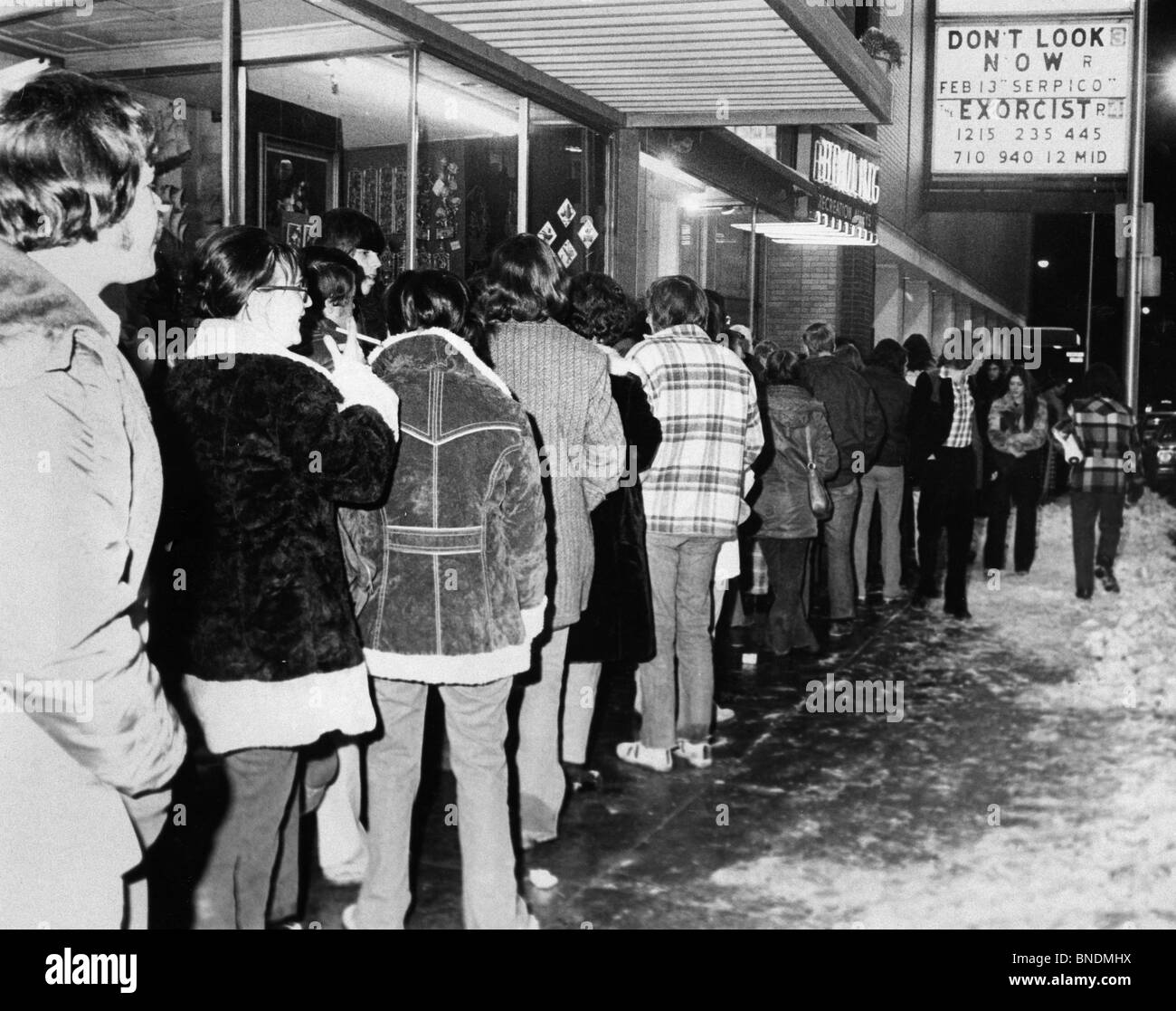 Group of people standing in a row outside a movie theater Stock Photo ...