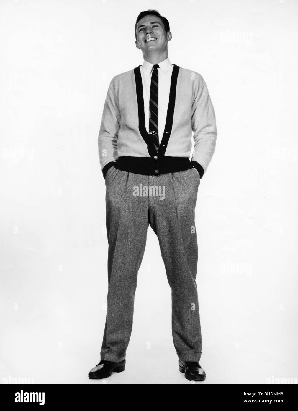 Man standing indoors in white Black and White Stock Photos & Images - Alamy