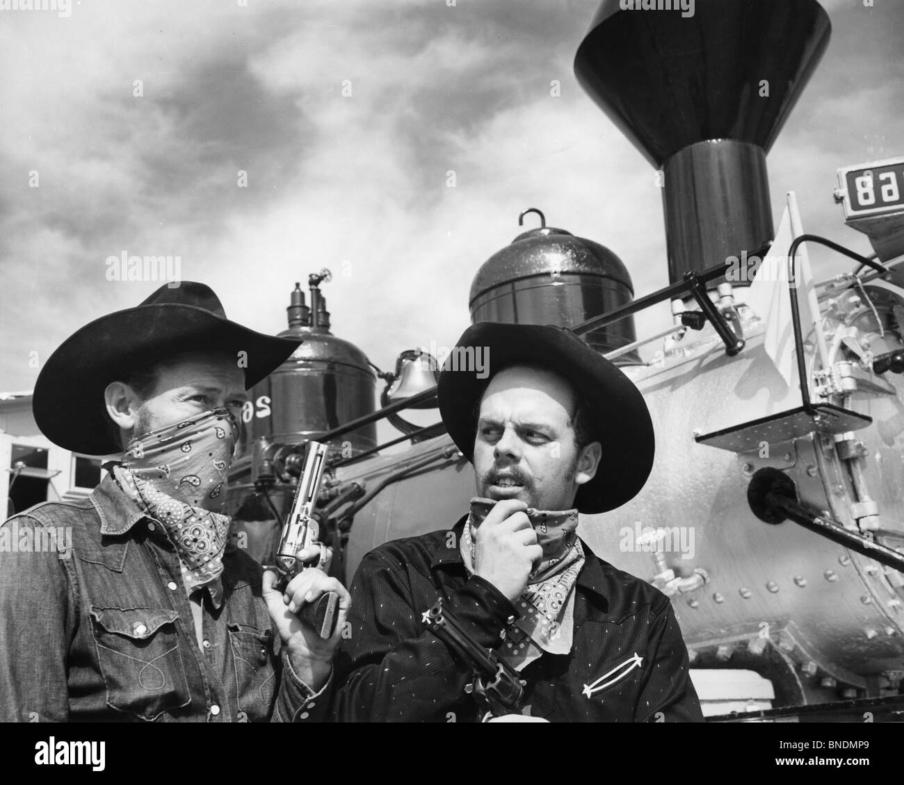 Young men standing face Black and White Stock Photos & Images - Alamy