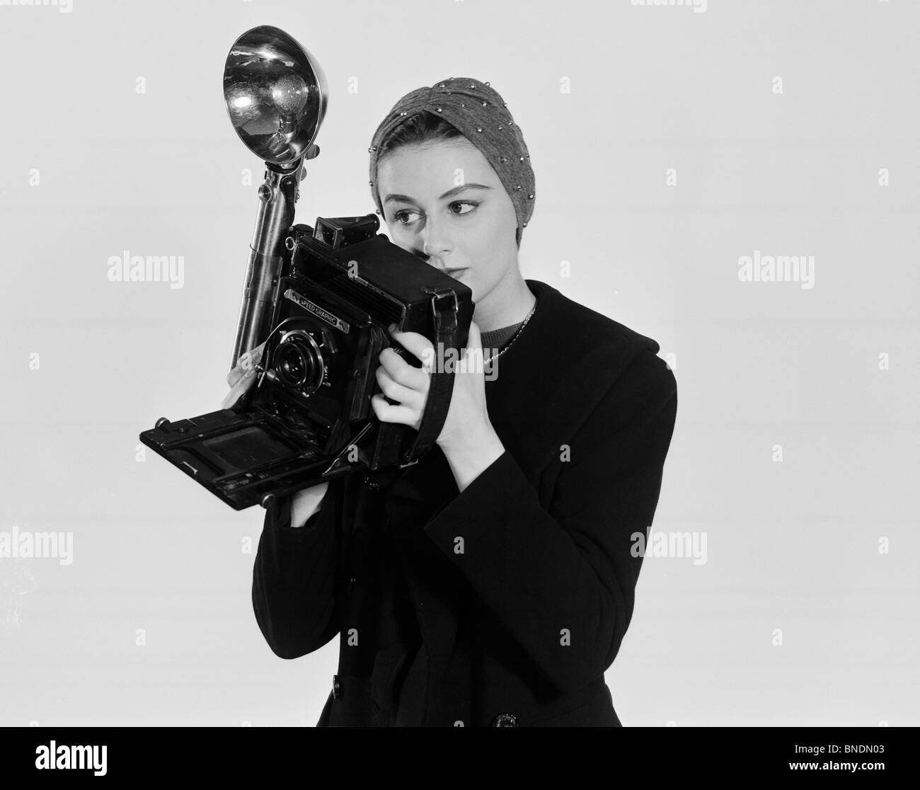 Person holding camera vintage Black and White Stock Photos & Images - Alamy