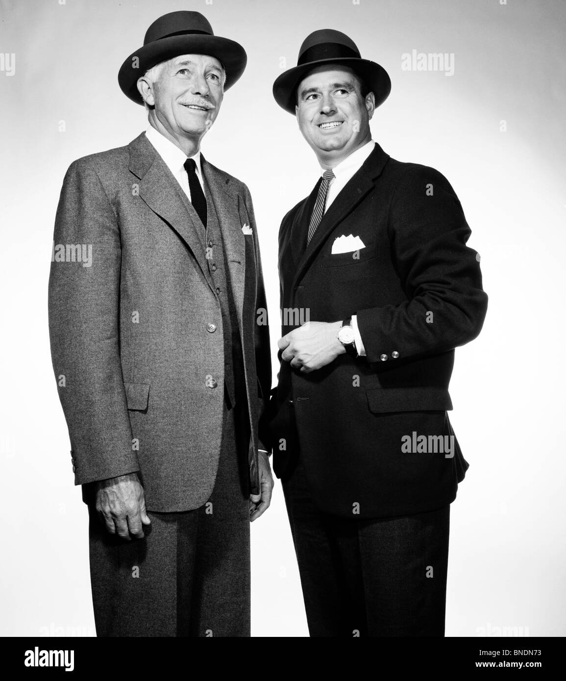 Two people smiling standing Black and White Stock Photos & Images - Alamy
