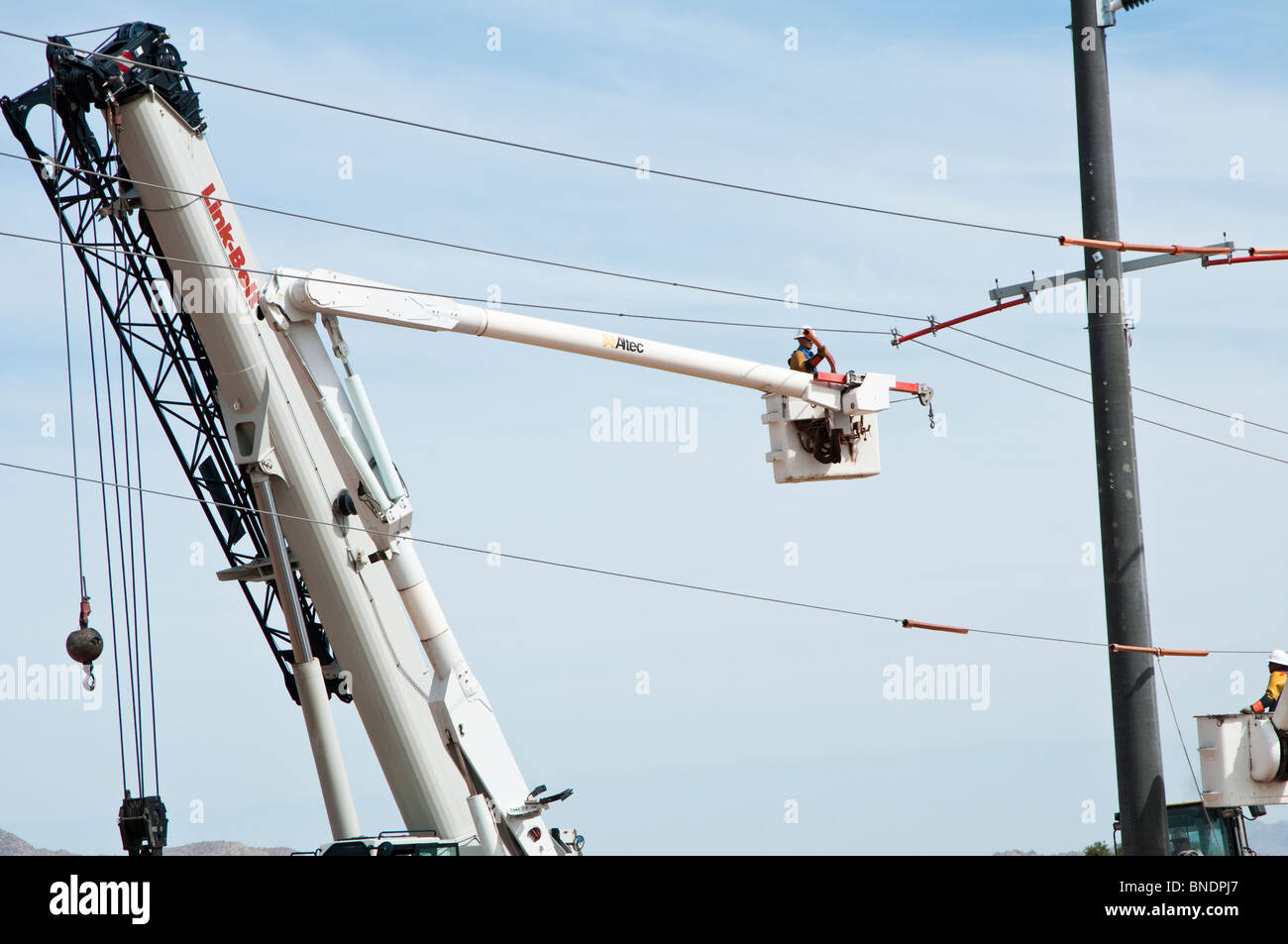 Construction workers in cherry picker hi-res stock photography and ...