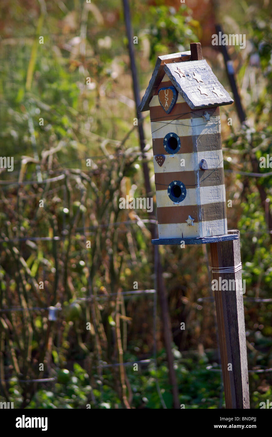 A birdhouse in a community garden Stock Photo - Alamy