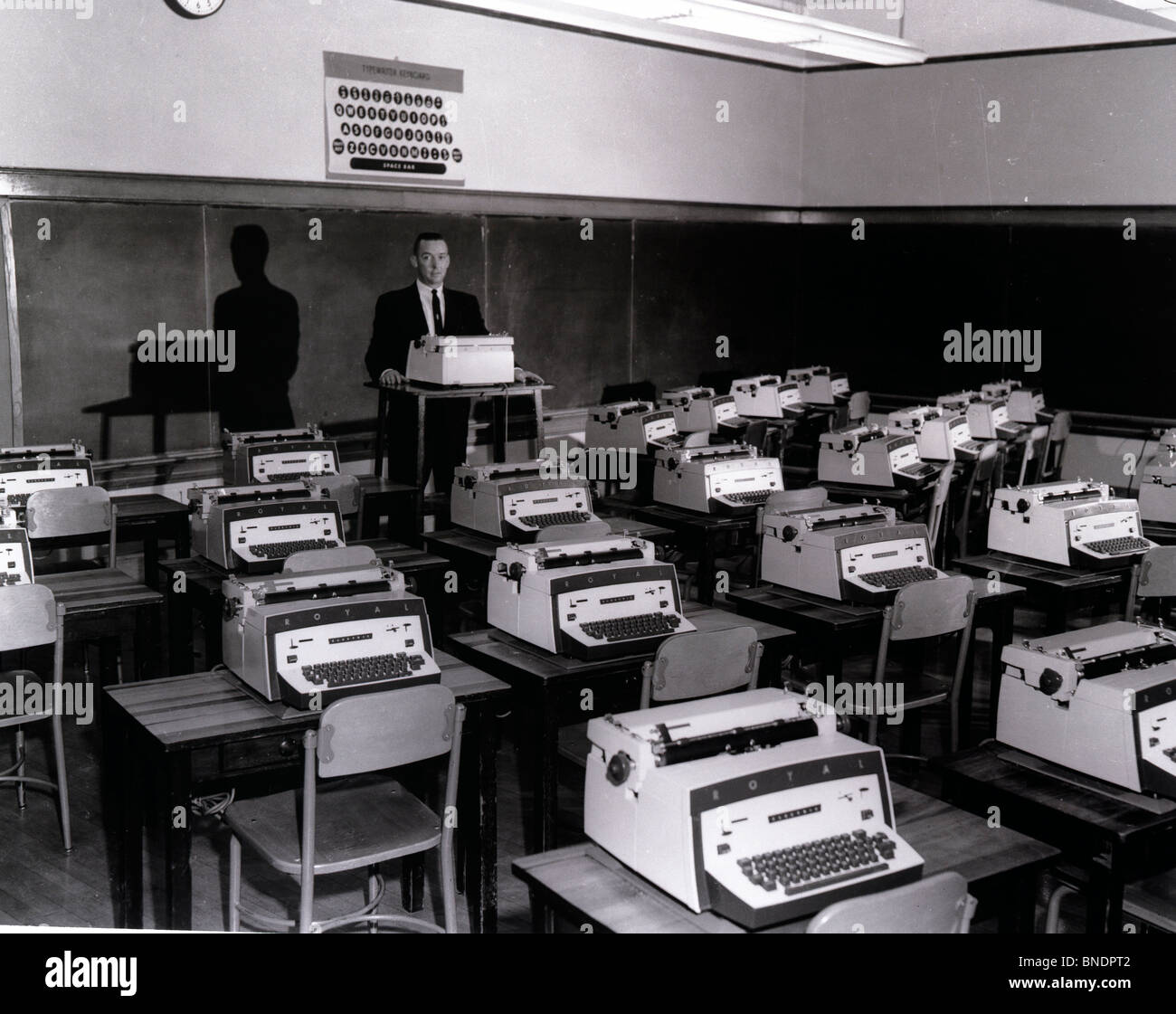 Teacher standing in a typing classroom, 1961 Stock Photo - Alamy