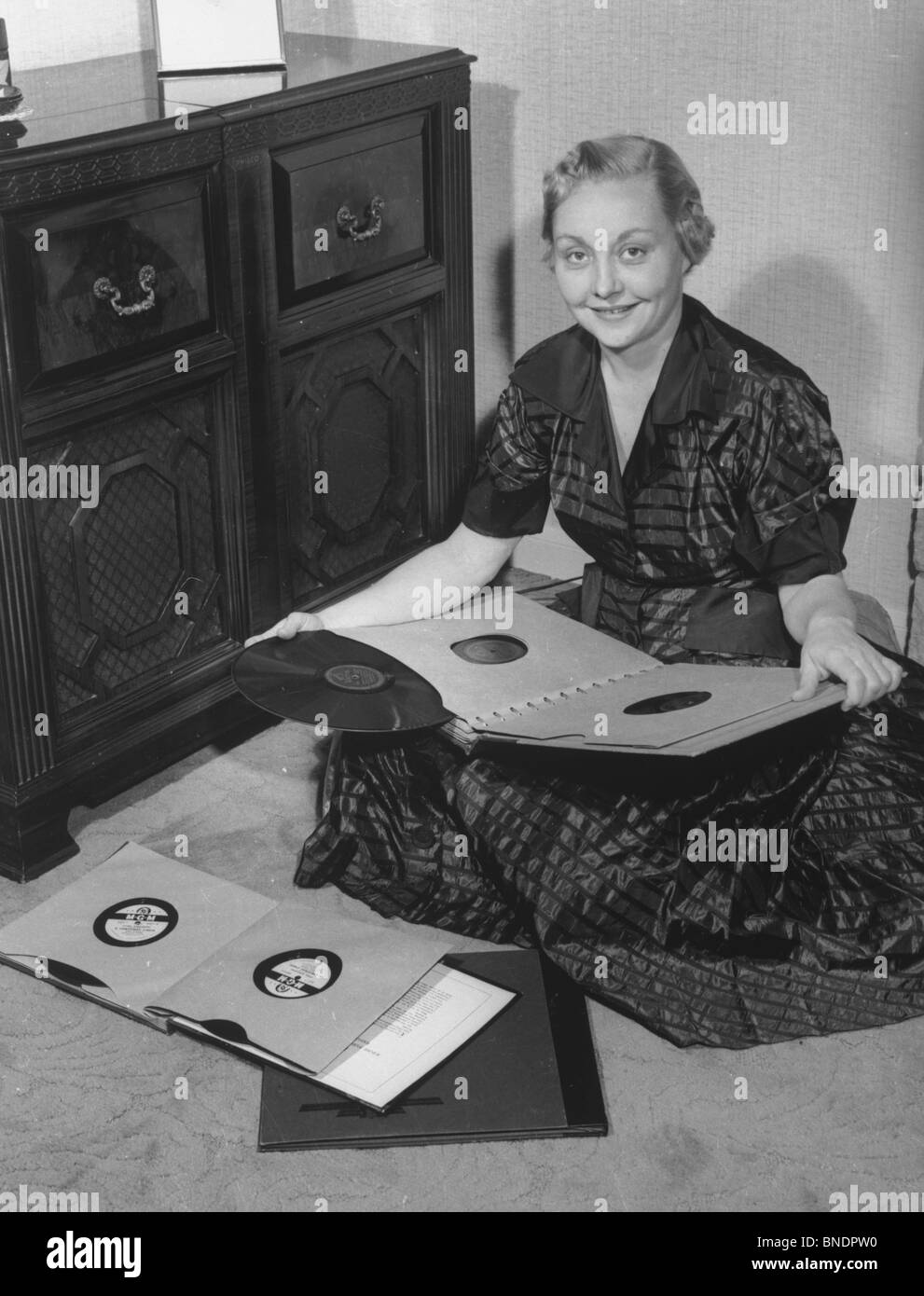 Woman holding a record Black and White Stock Photos & Images - Alamy