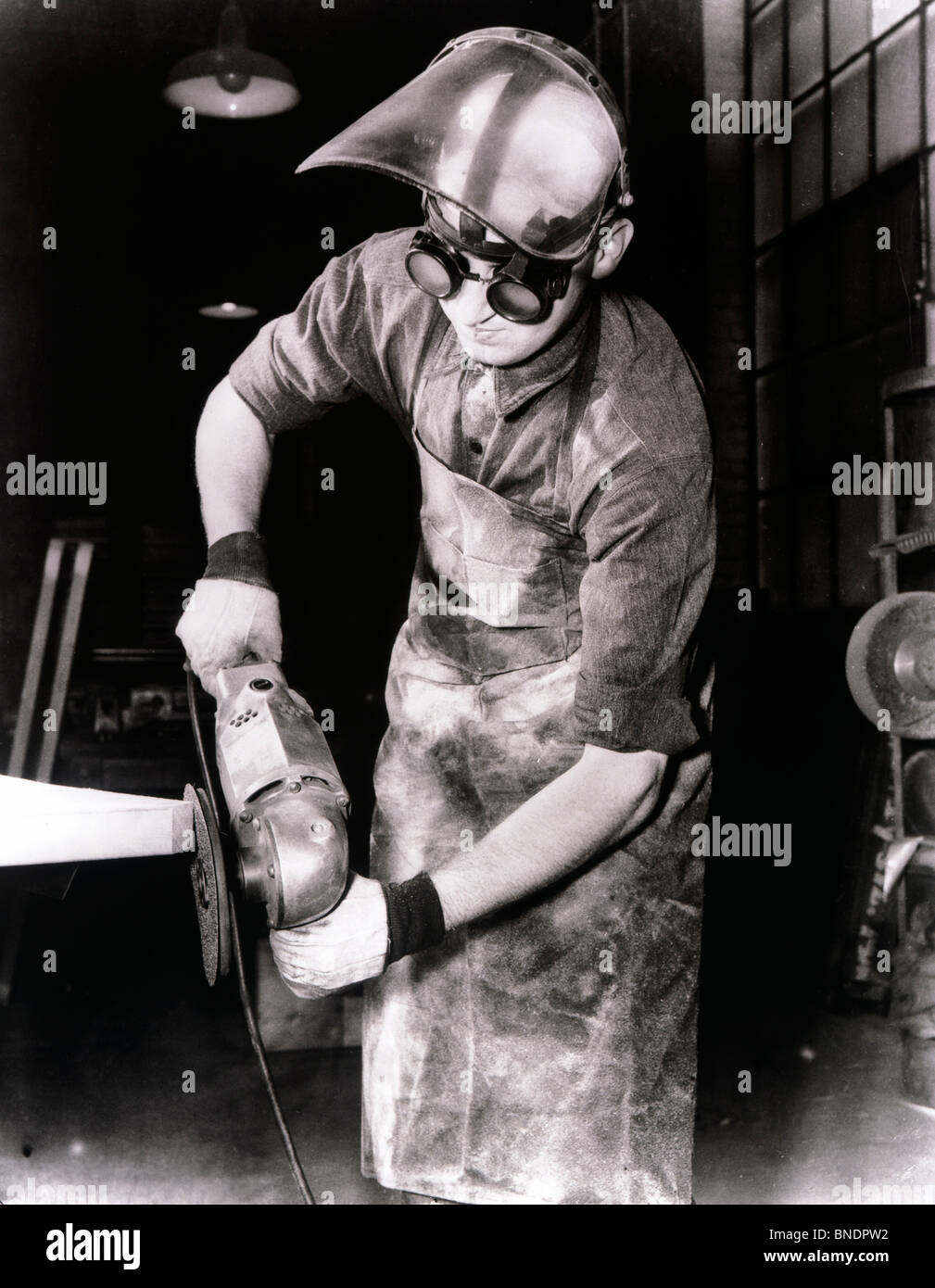 Carpenter working in a factory with a wood sander Stock Photo - Alamy