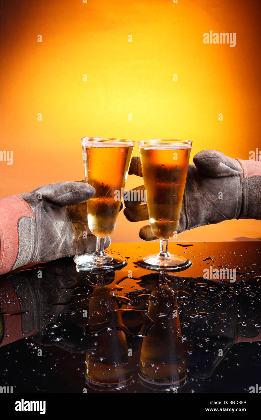 Celebrating a hard day of work with a couple of beers Stock Photo - Alamy