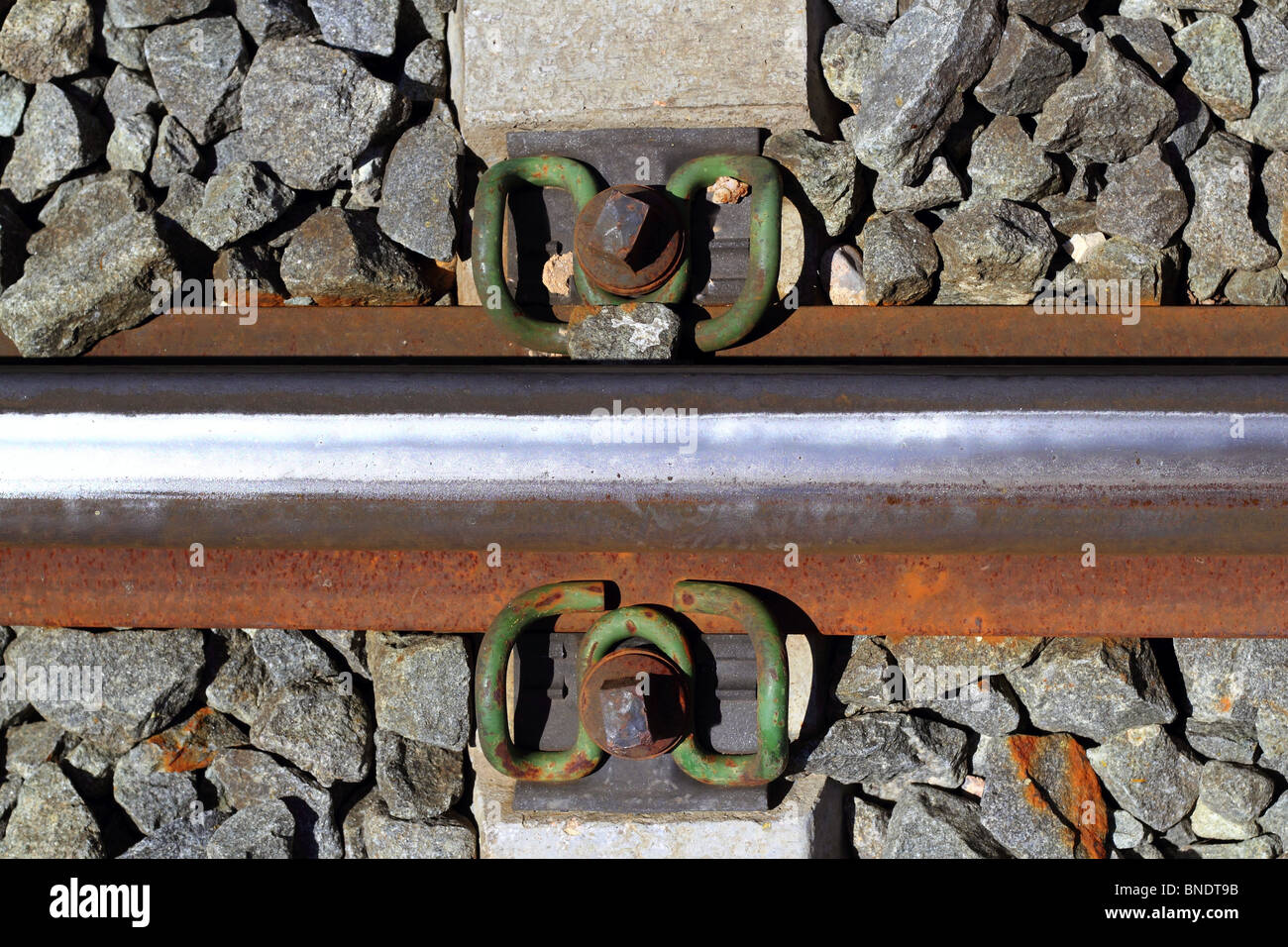iron rusty train railway detail over dark stones rail way Stock Photo ...