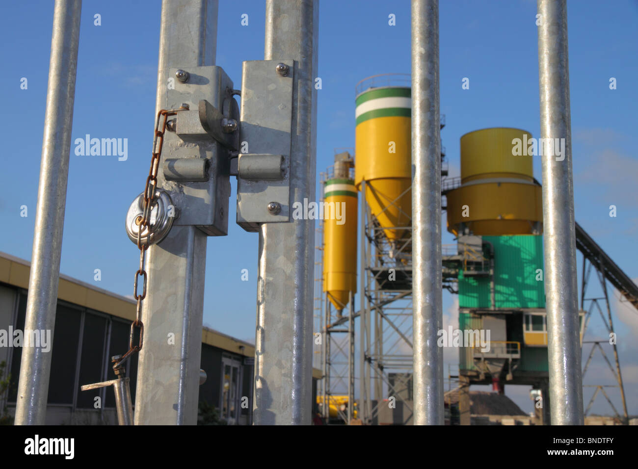 Fence with lock at cement / concrete factory Stock Photo - Alamy