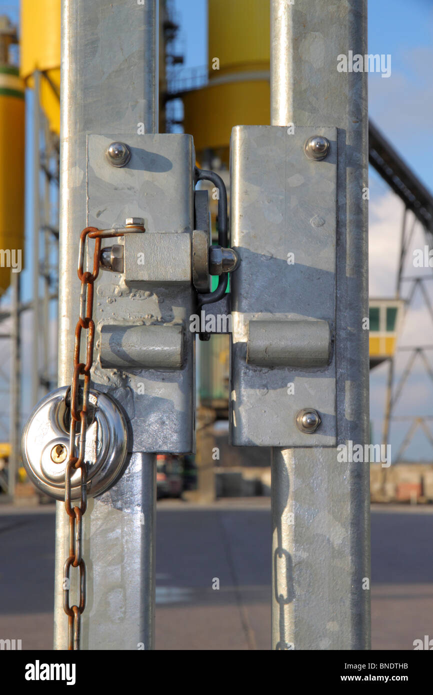 Fence with lock at cement / concrete factory Stock Photo - Alamy