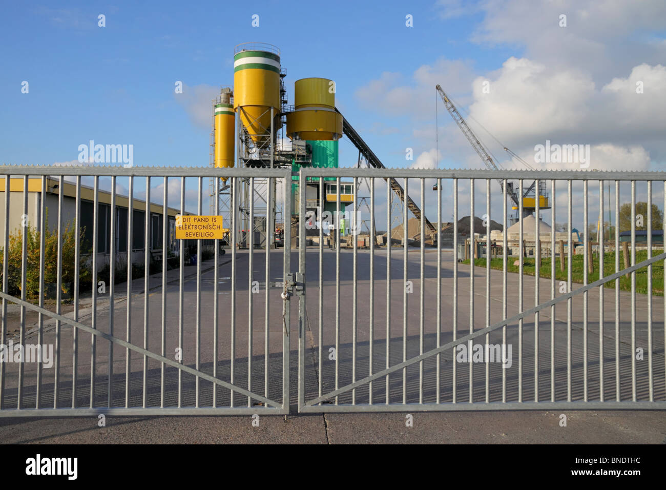 Fence with lock at cement / concrete factory Stock Photo - Alamy