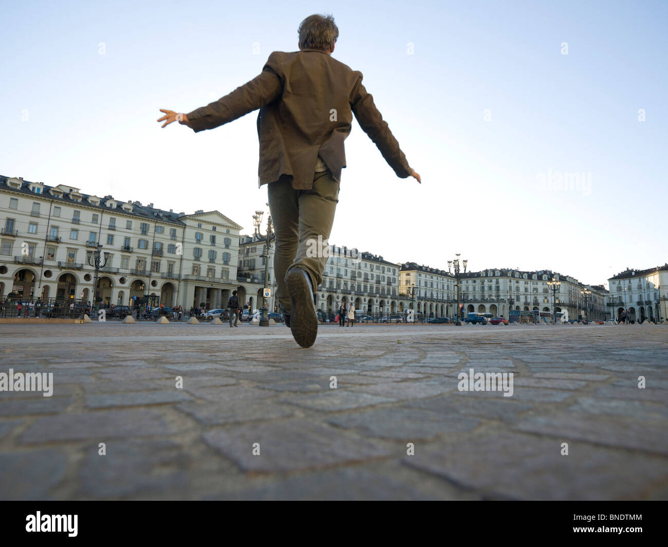 Man running on a pavement, Turin, Piedmont, Italy Stock Photo - Alamy