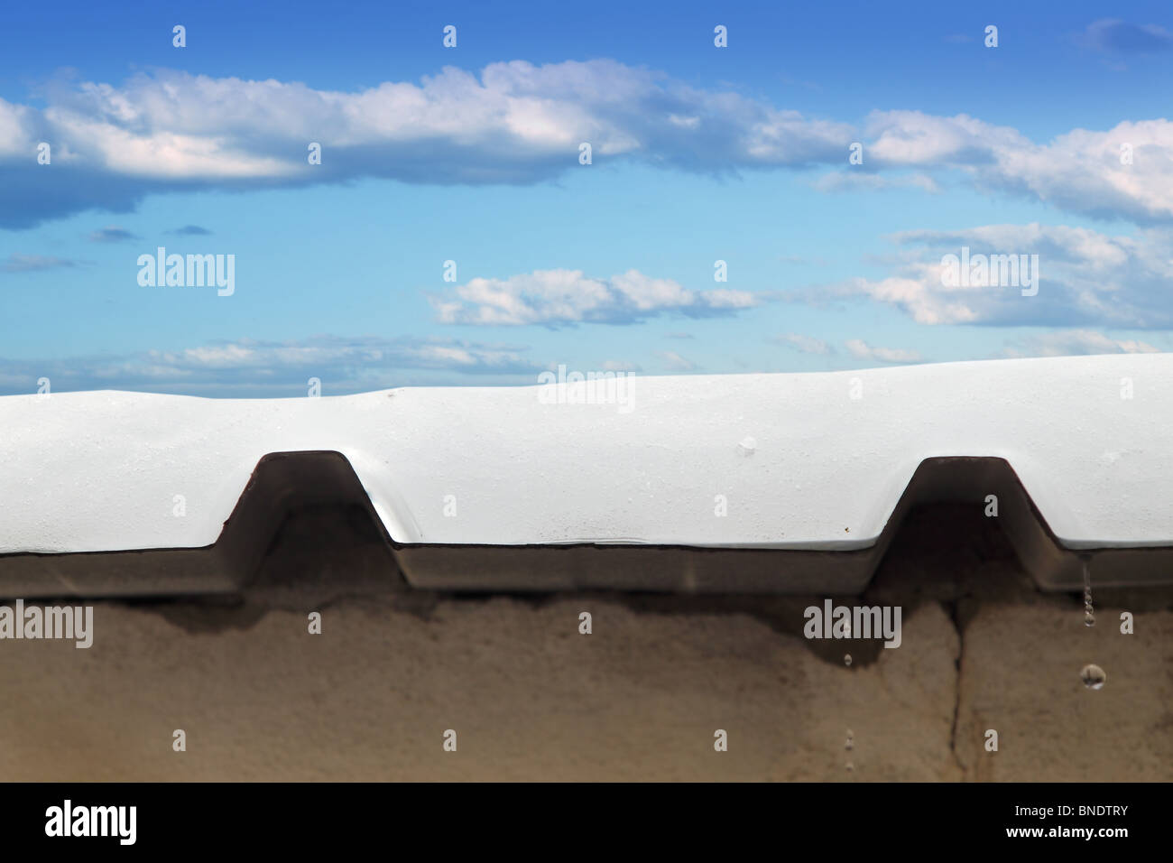 metal snow roof meltwater cross section blue sky Stock Photo - Alamy