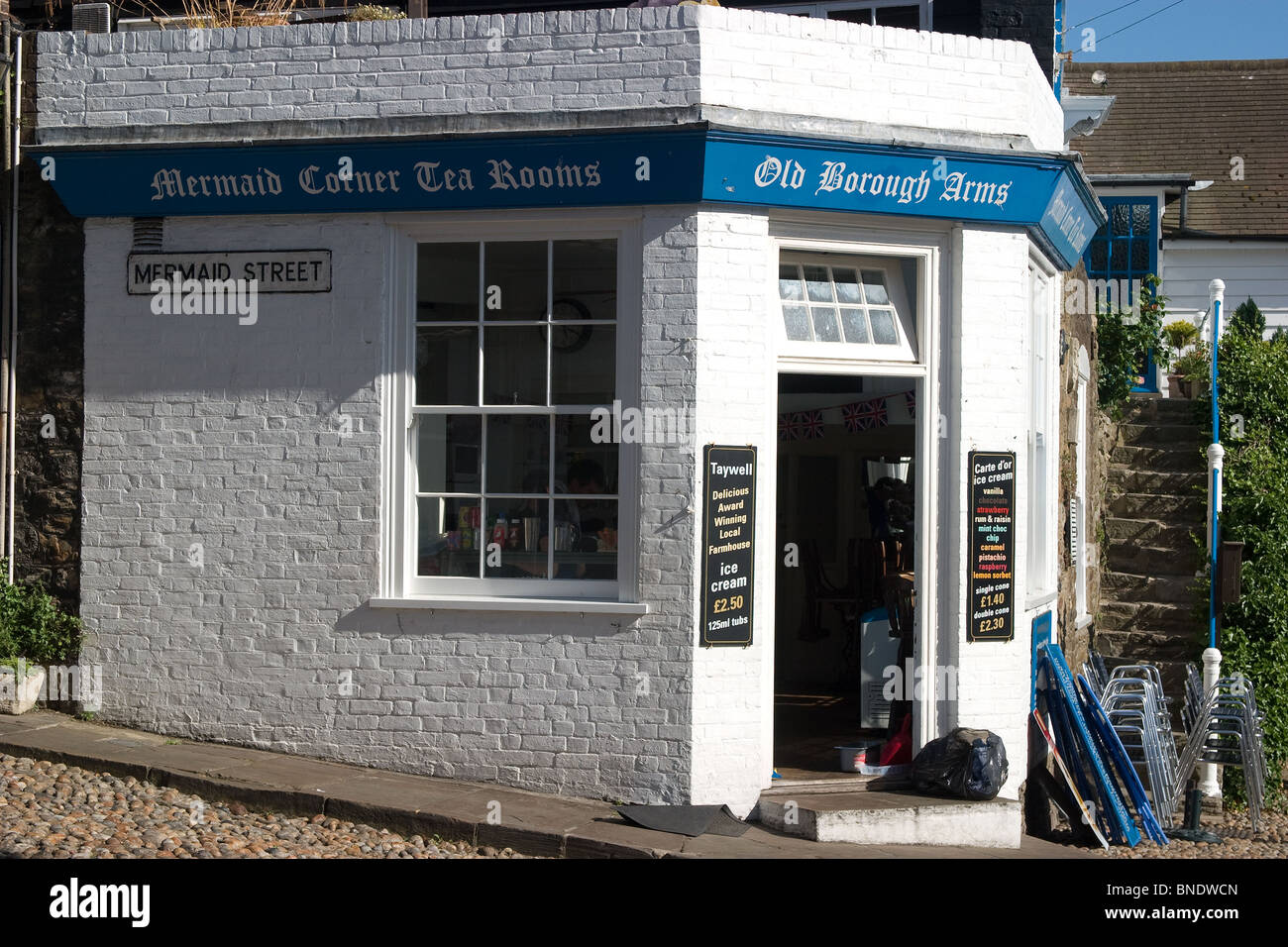 corner cafe white blue door windows traditional Stock Photo - Alamy