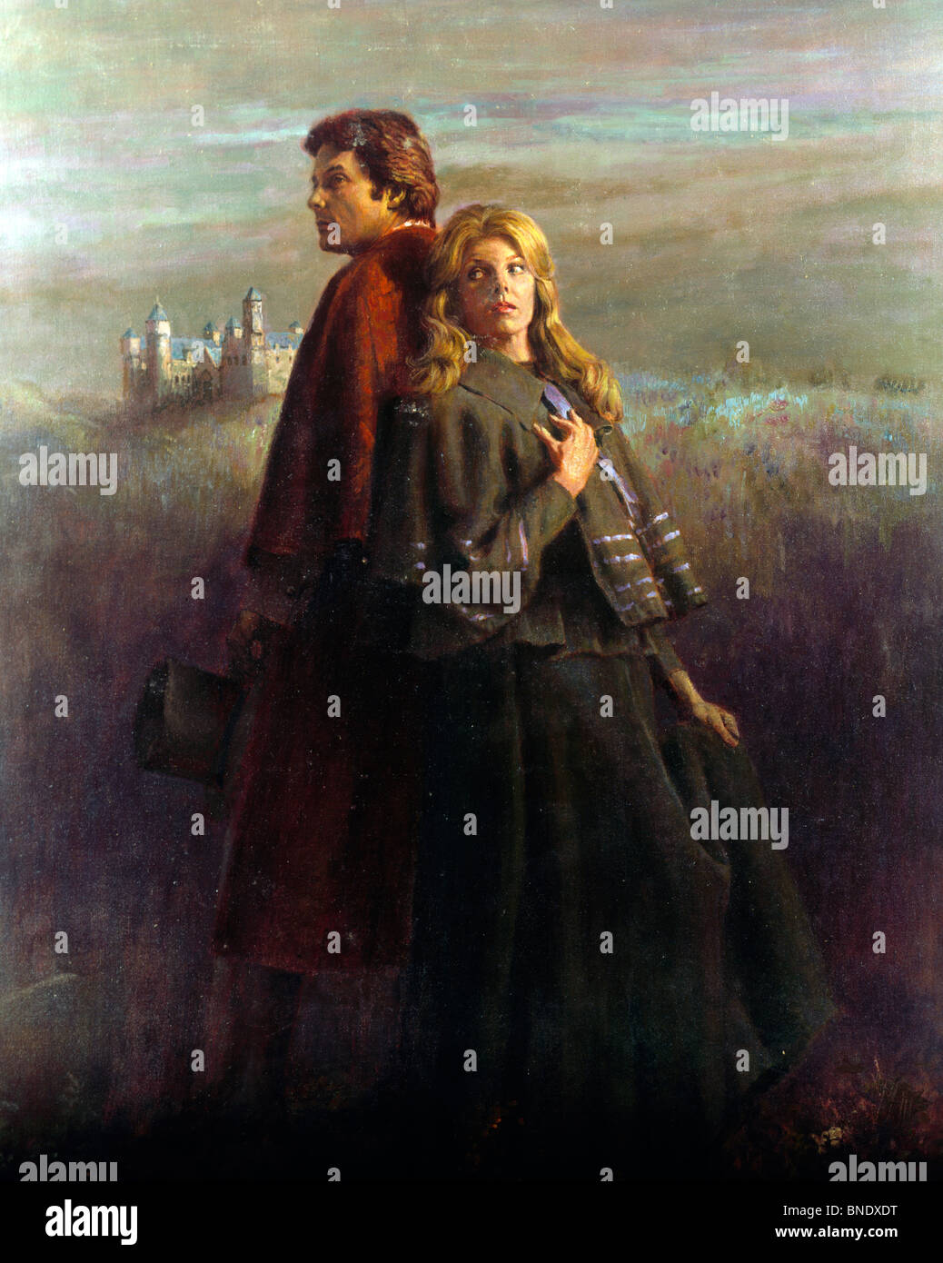 Couple standing back to back Stock Photo - Alamy