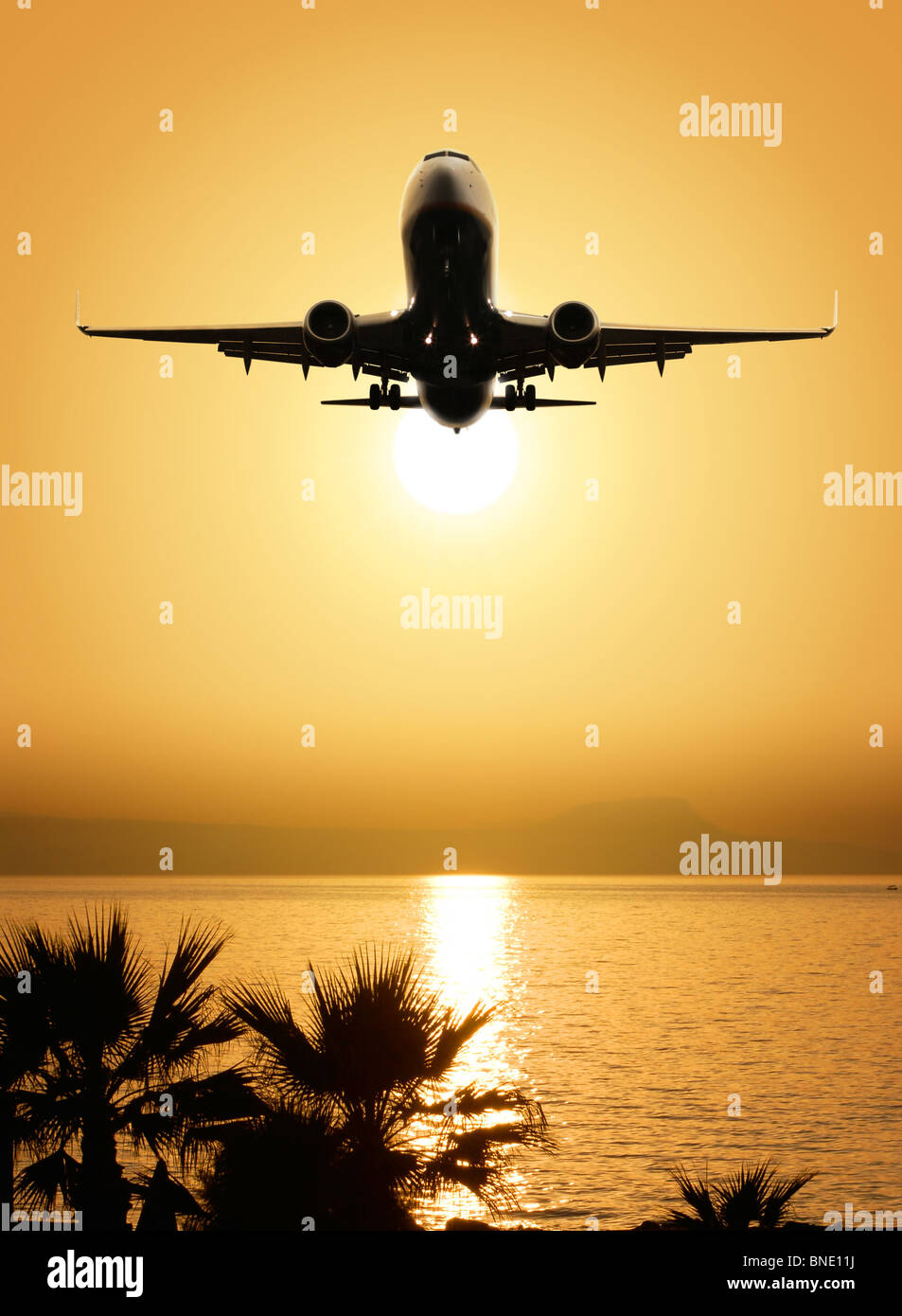 beautiful sea view and plane on sunset background Stock Photo - Alamy