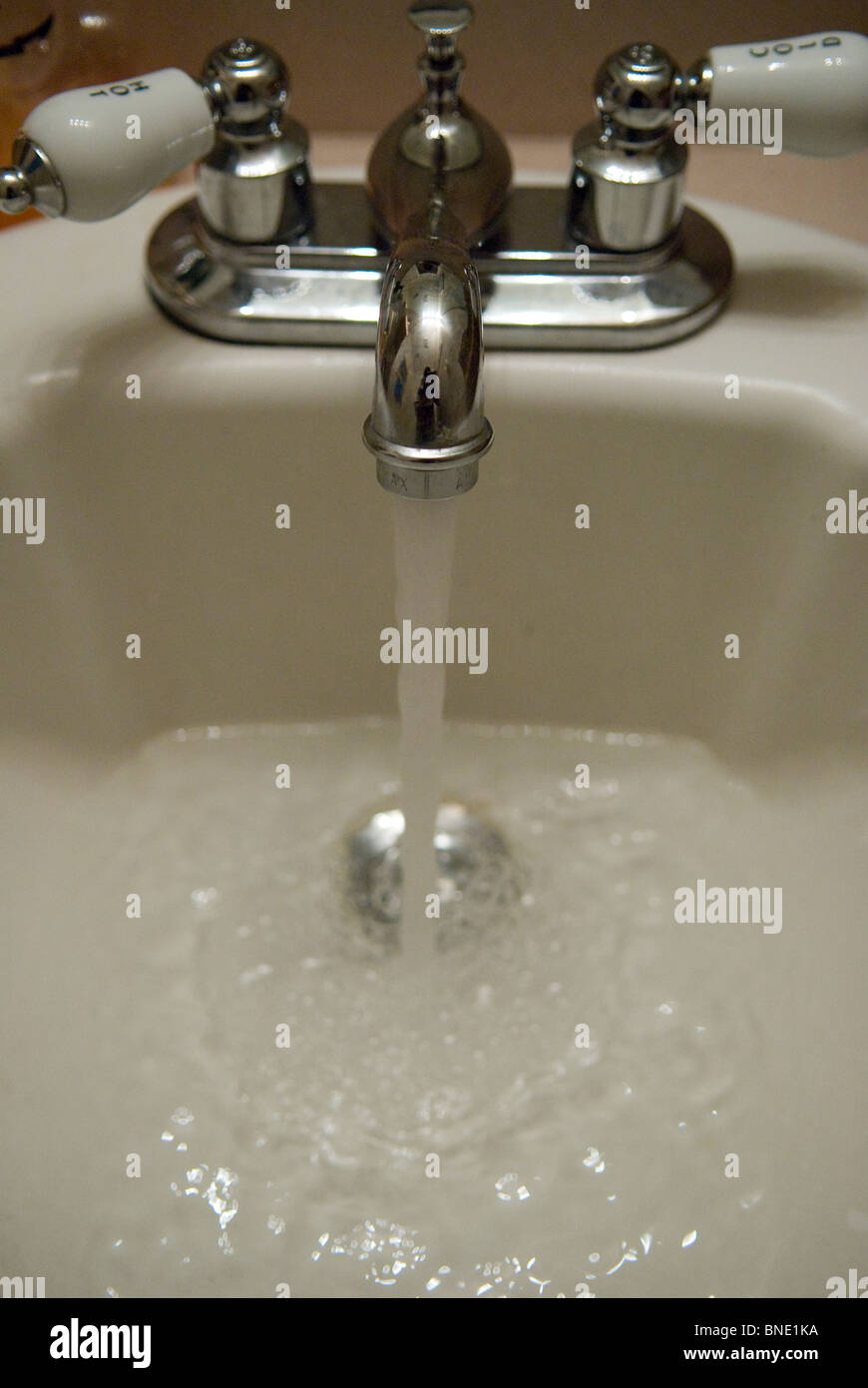 Close-up of water running from a faucet Stock Photo - Alamy
