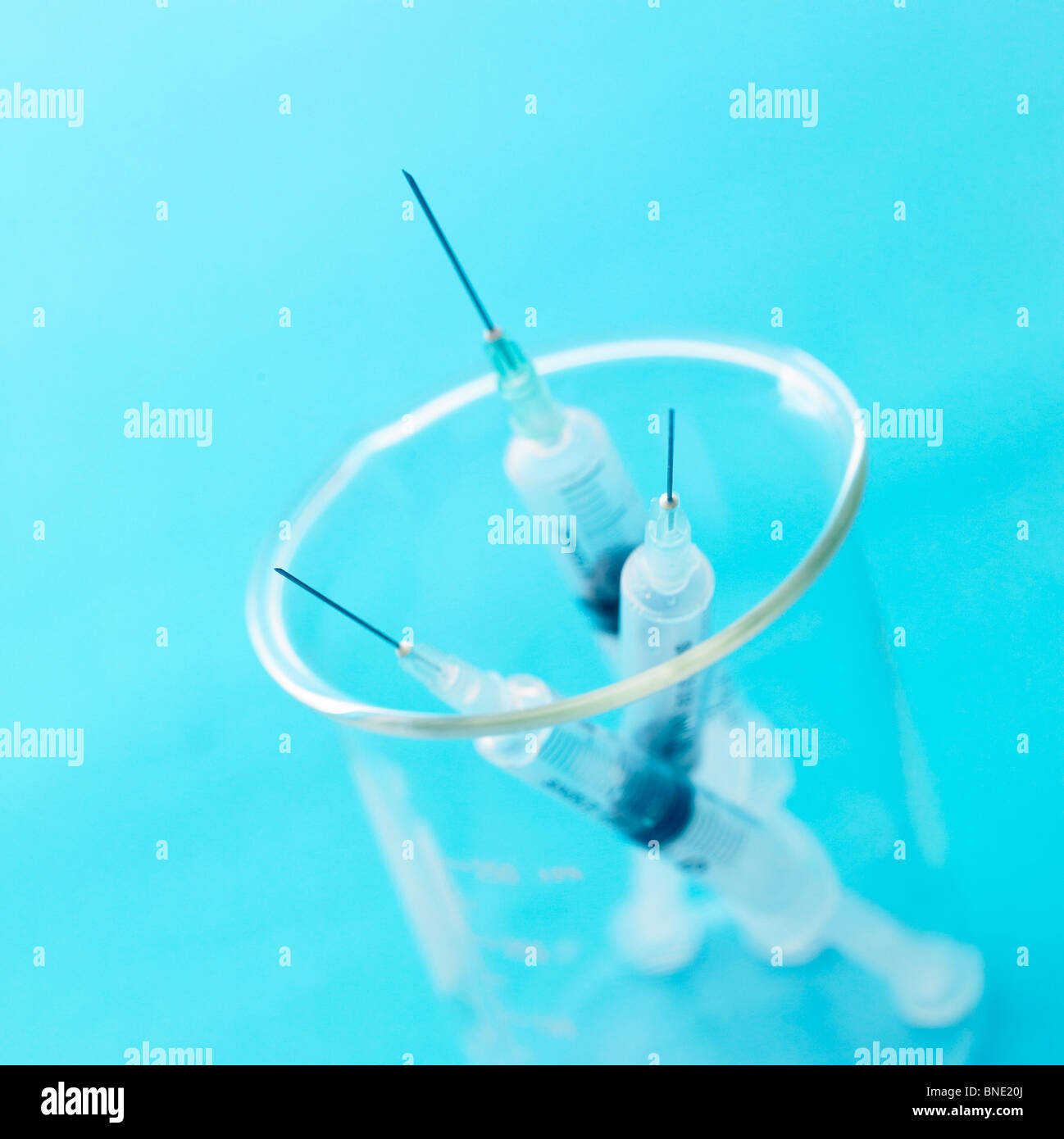 Close-up of Syringe in Beaker Stock Photo - Alamy