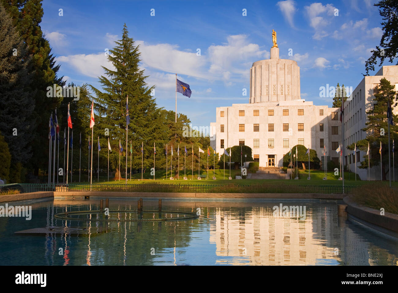 Reflection of a government building in a pond, Oregon State Capitol ...
