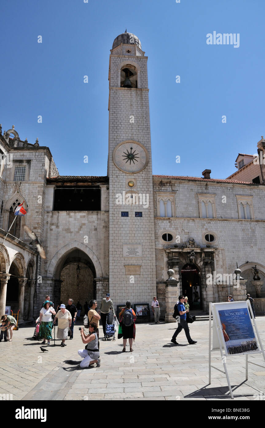 Tourists enjoying the sights of Luza Square with its Bell Tower and ...