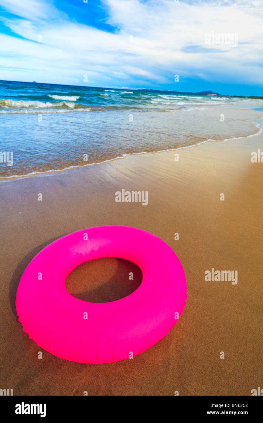 Pink Inflatable tube on the tropical beach Stock Photo - Alamy