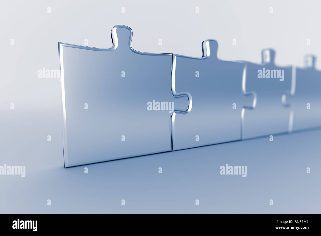 Row of connected puzzle pieces Stock Photo - Alamy