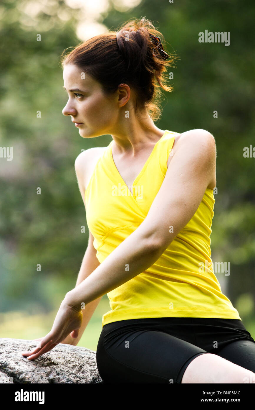 girl back stretching sitting outdoor park evening Stock Photo - Alamy