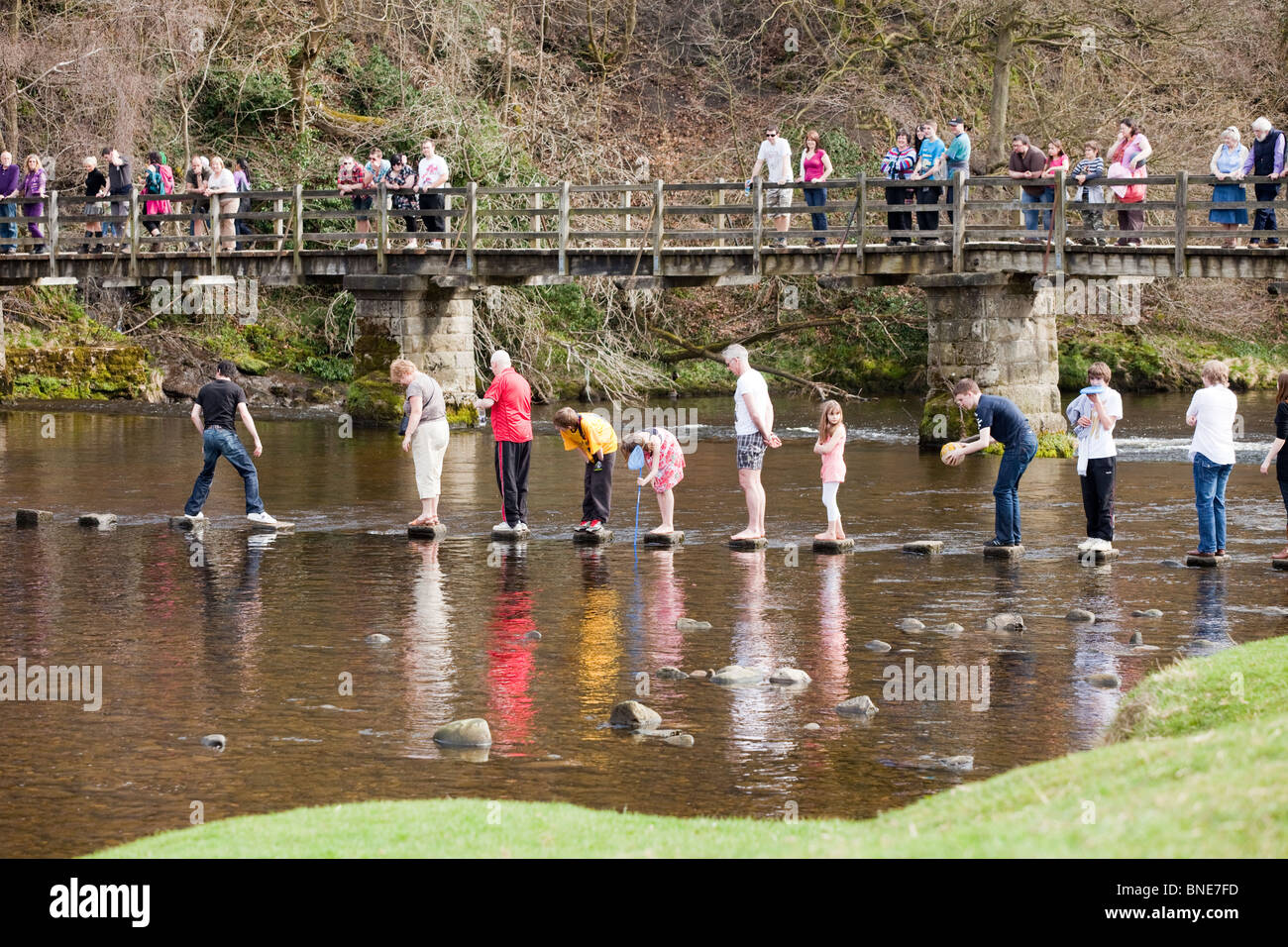Crossing the river wharfe via stepping stones hi-res stock photography ...