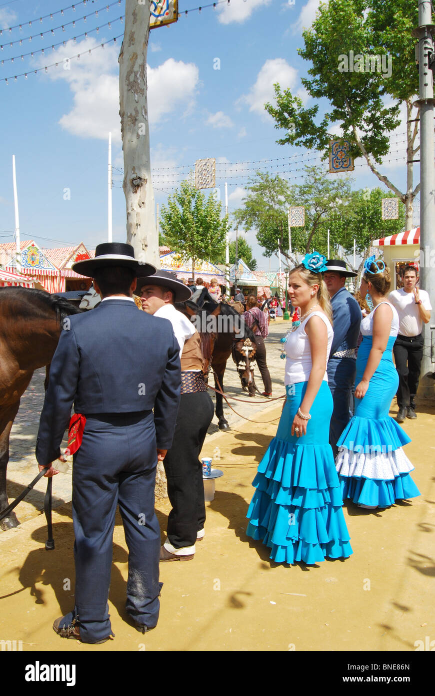 People in traditional dress, Feria ground, April spring fair, Seville ...