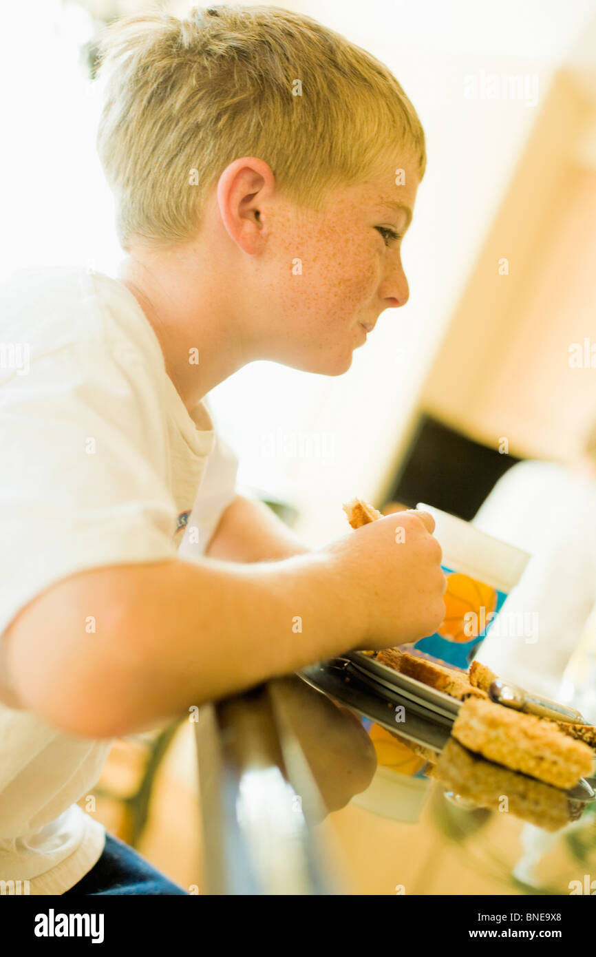Boy having breakfast Stock Photo - Alamy