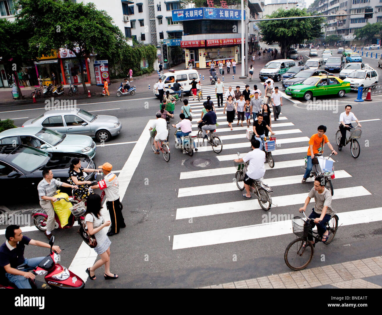 People walking on zebra crossing, Beijing, China Stock Photo - Alamy
