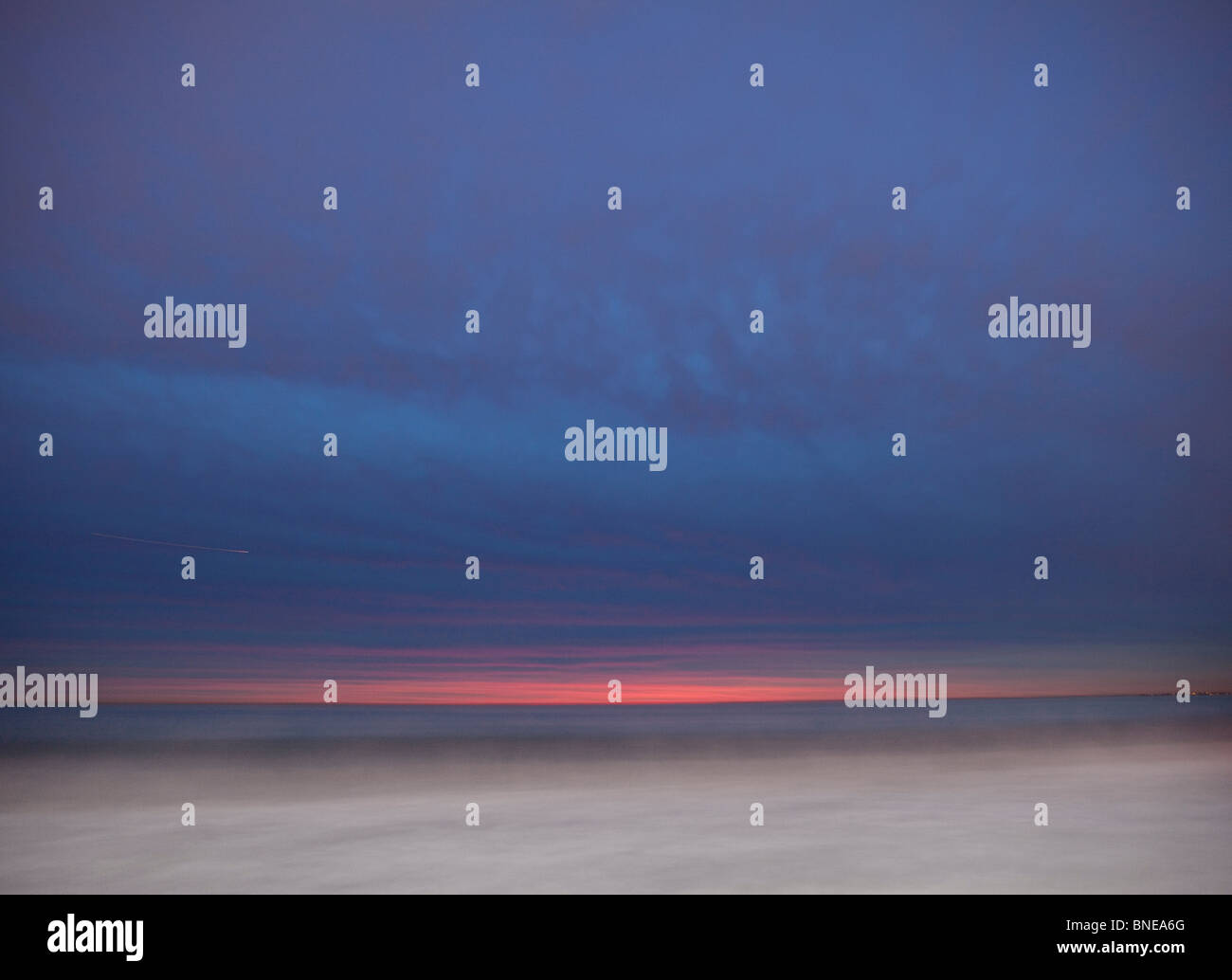 Ocean at dusk Stock Photo - Alamy