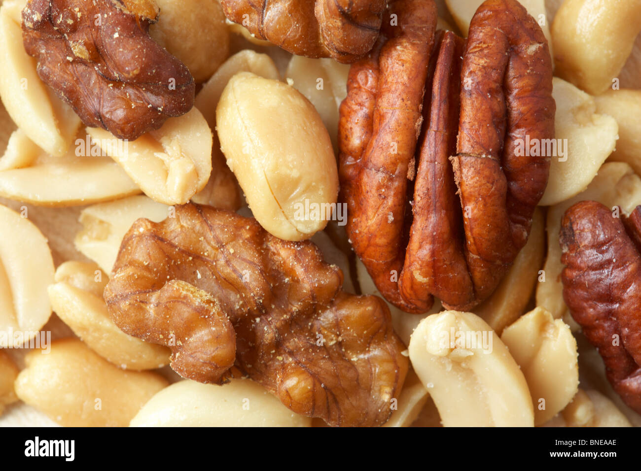 close up of mixed nuts roasted salted peanuts walnuts and pecans Stock ...