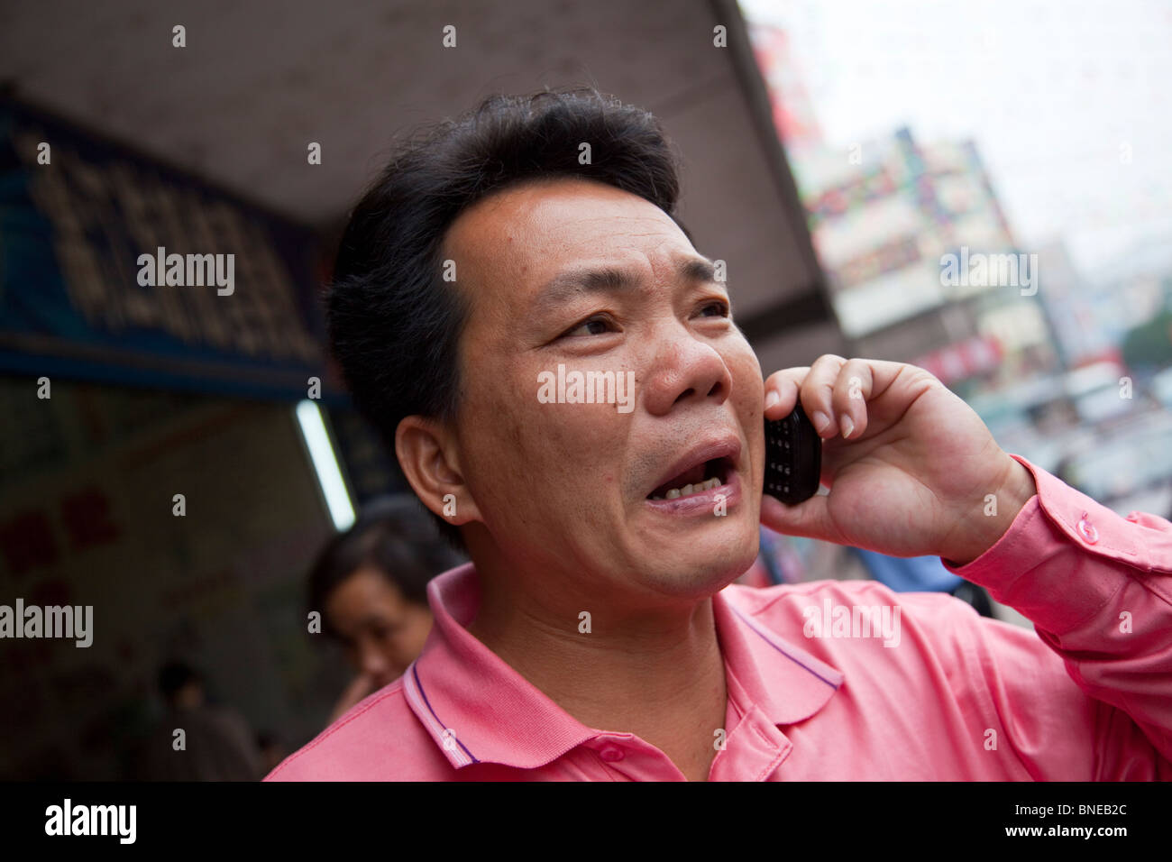 Chinese man talking on a mobile phone in Guilin, Guangxi Province ...