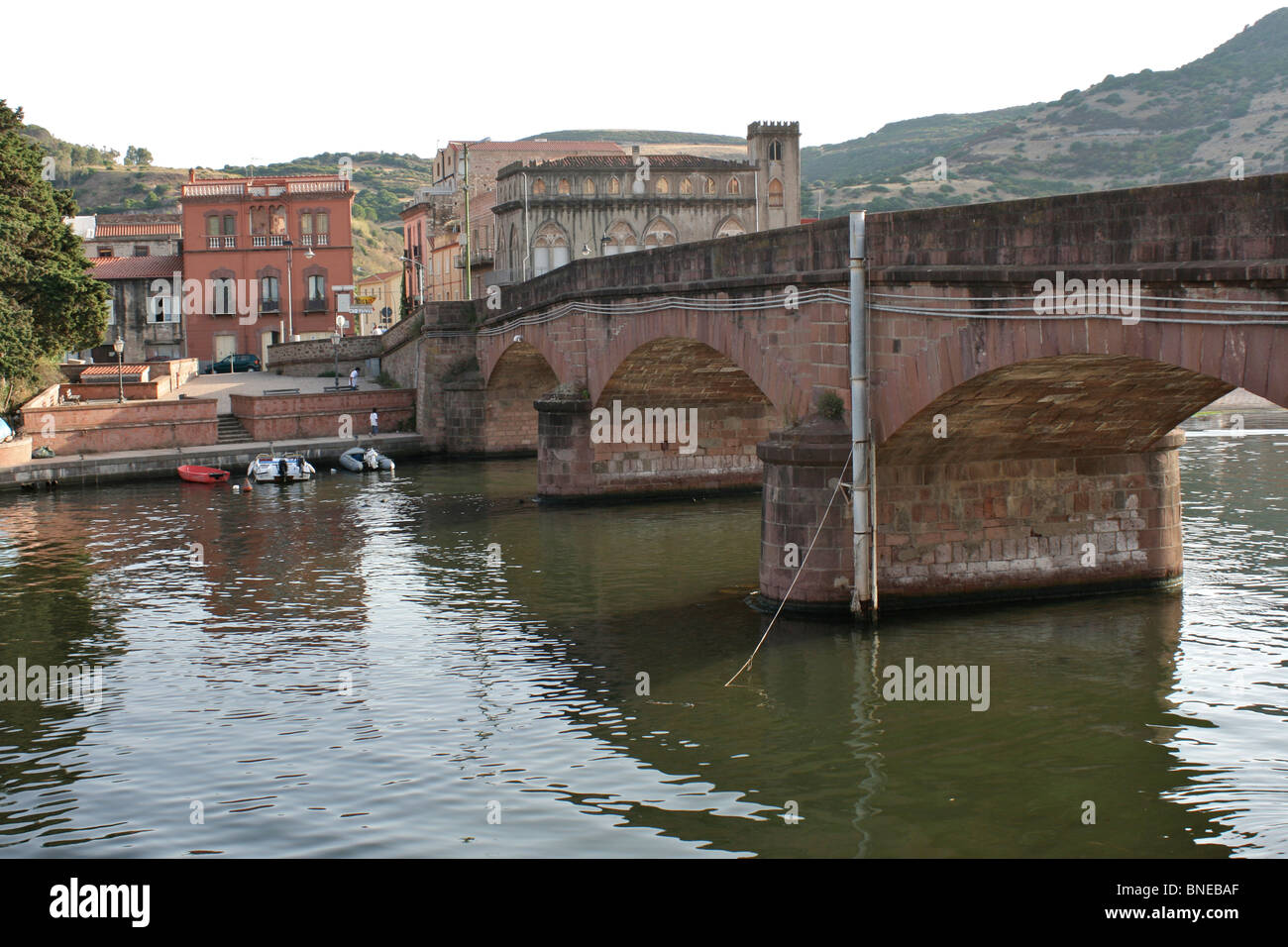 The old brick and stone built bridge crossing the river Temo with the ...