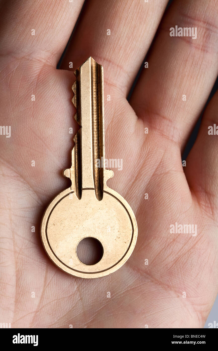 Golden House Key close up Stock Photo - Alamy